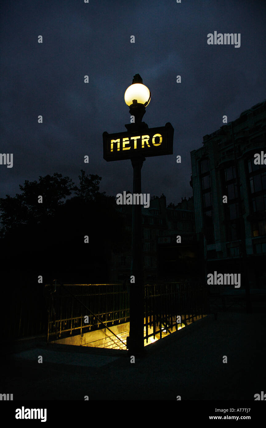 Paris Metro sign at night Stock Photo - Alamy