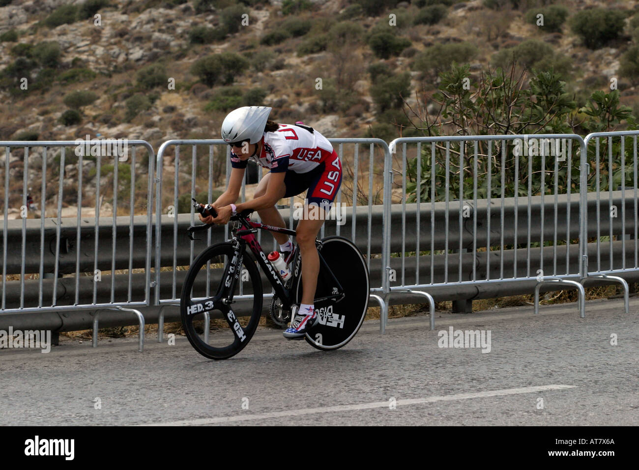 American female cyclist out on the time trial course on practice day ...