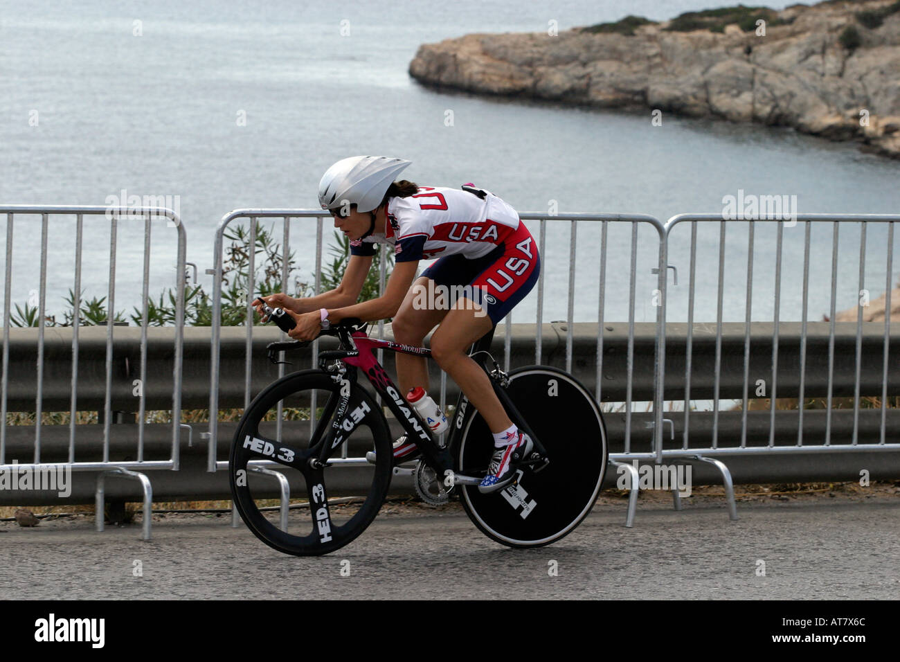 American female cyclist out on the time trial course on practice day ...