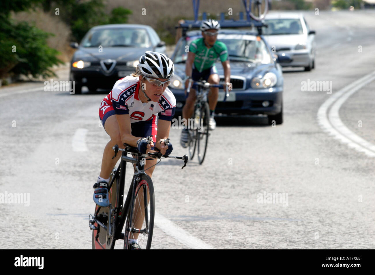 American female cyclist out on the time trial course on practice day ...