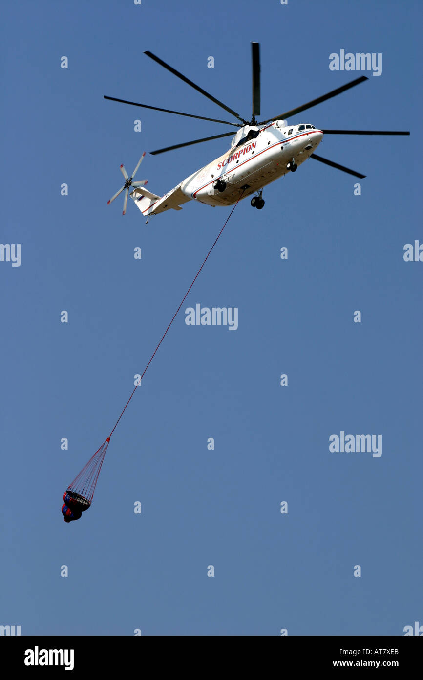 A Russian built MI 26T heavy lift fire service helicopter carries a ...