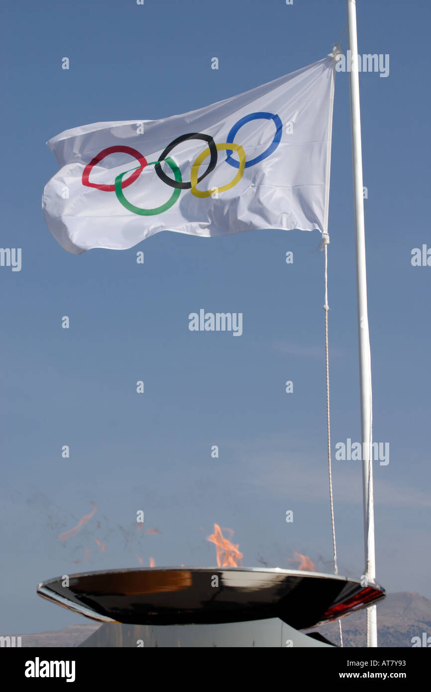 The Olympic Flag flying above the Olympic flame Stock Photo - Alamy