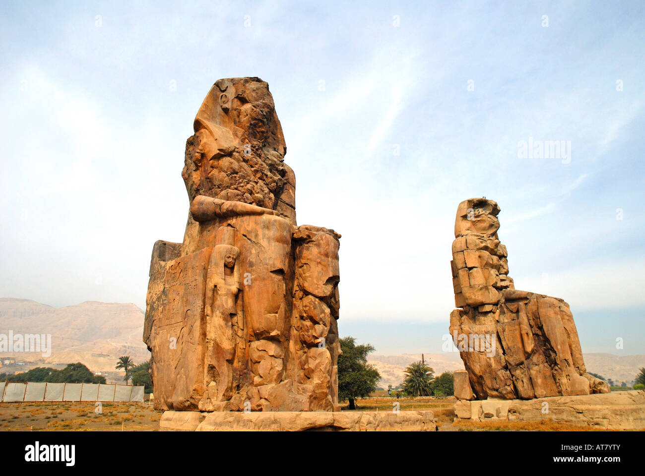 The Colossus of Memnon on the outskirts of Luxor in Egypt are two ...