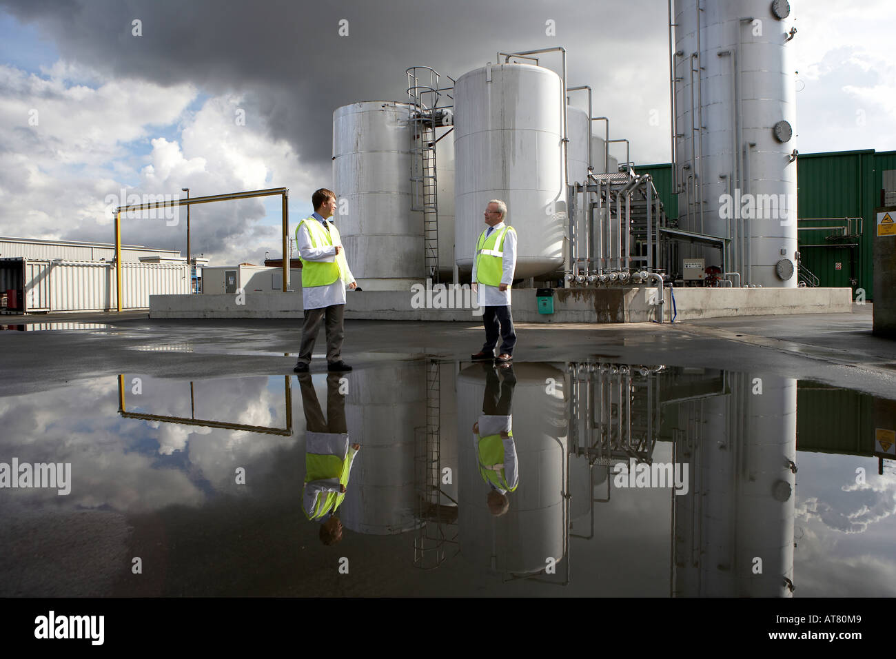 Two workers and reflections of a bulk liquid storage facility Goole ...