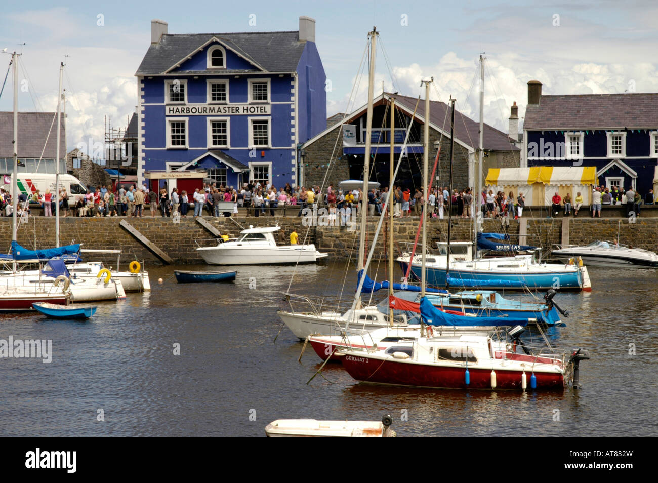 View across the harbour at Aberaeron showing the famous Harbourmaster ...