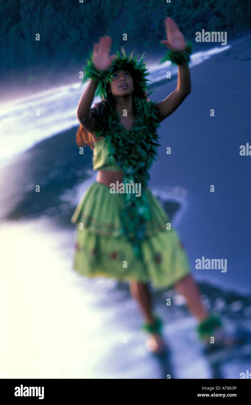 Local Hawaiian young woman dancing in Waipio Valley wearing ti leaves ...