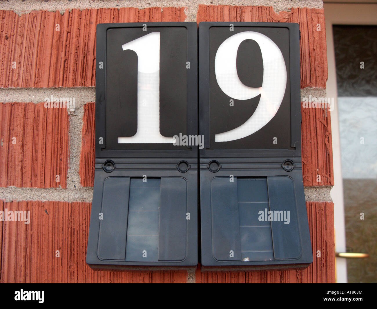 solar powered house number 19 on red brick house outside Belfast Stock ...