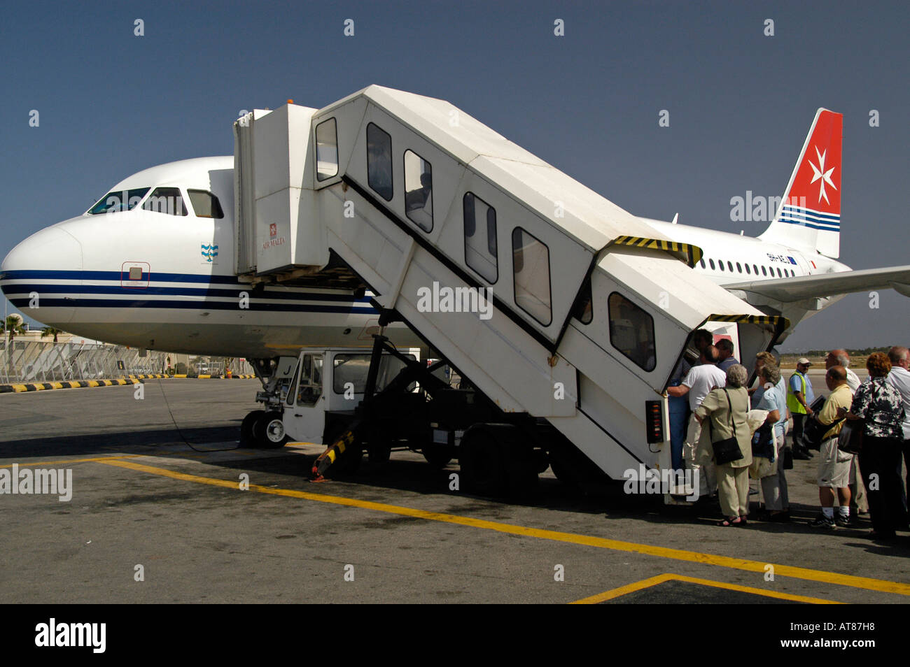 Passengers boarding Air Malta flight, Malta Stock Photo - Alamy