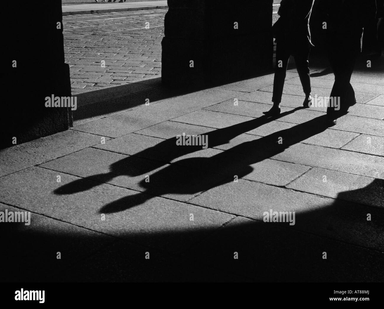 Two human shadows on street hi-res stock photography and images - Alamy