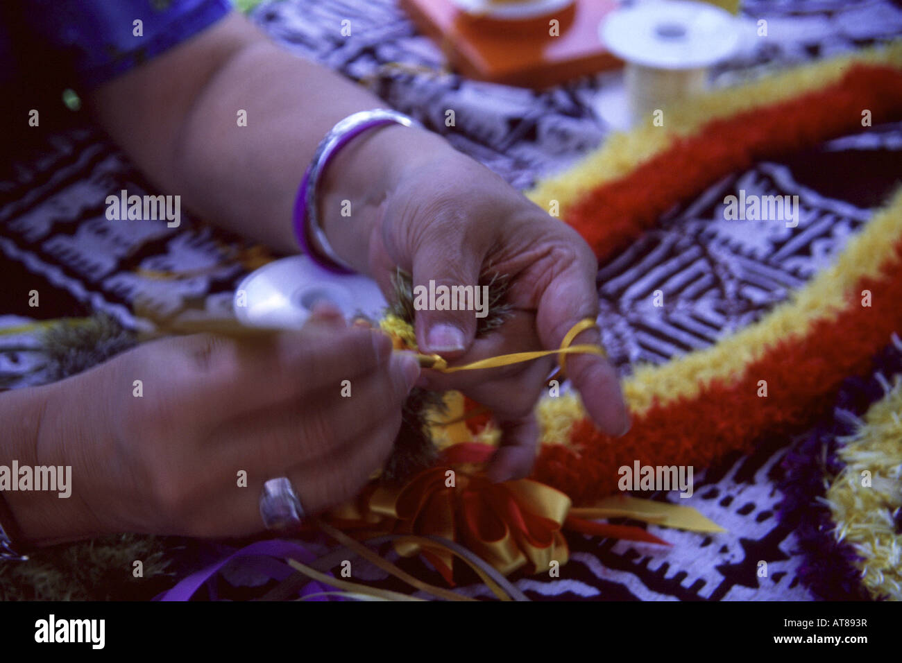 Lei maker at lei day craft booth hi-res stock photography and images ...