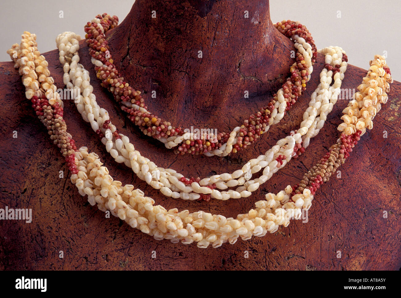 Three rare Niihau shell necklaces on statue figure Stock Photo - Alamy