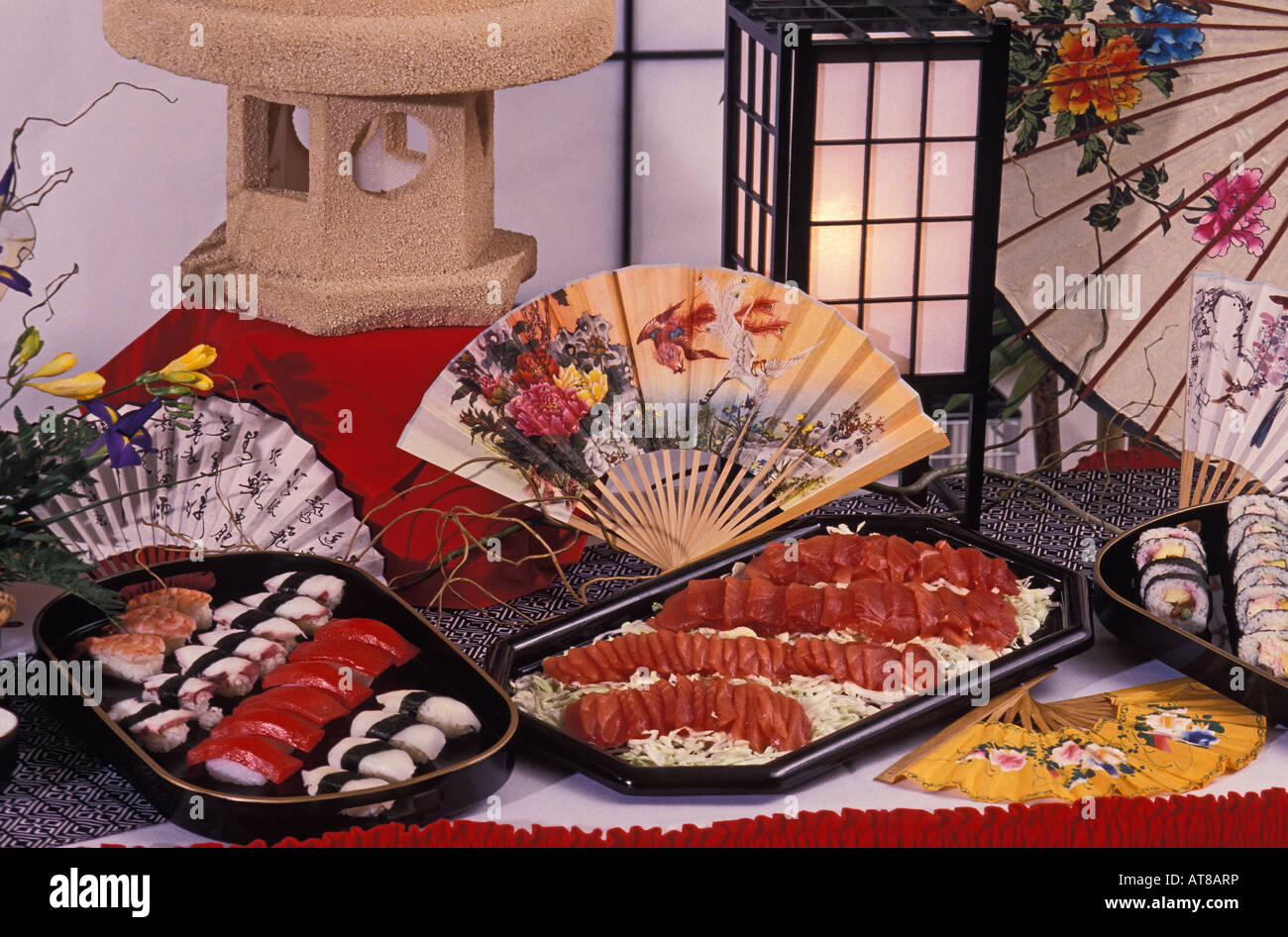 A delicious assortment of sushi and sashimi platters set on a Japanese ...