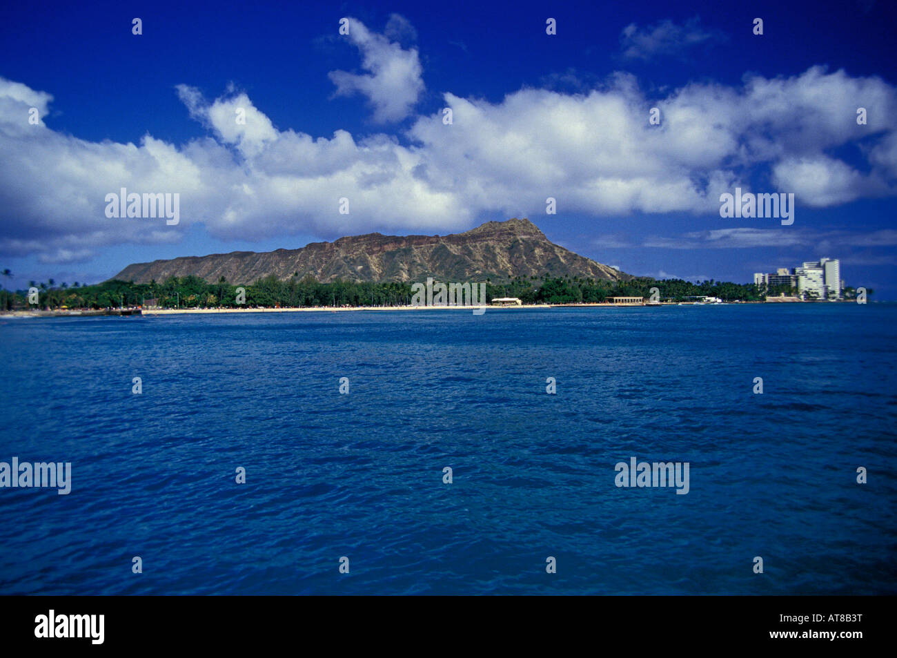 Diamond Head from the ocean with fluffy white clouds above Stock Photo ...