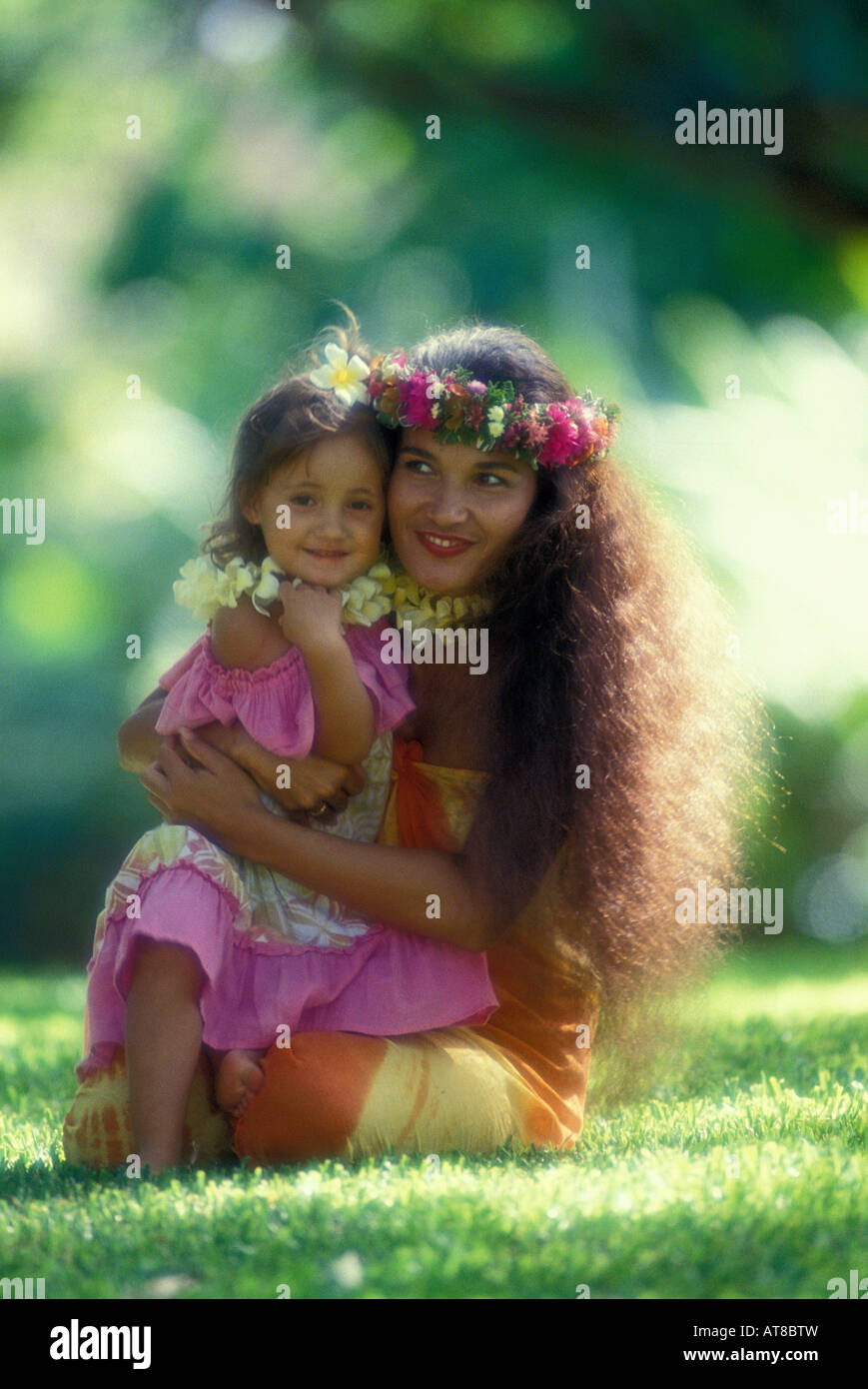 Beautiful Polynesian woman and daughter, dressed in colorful aloha wear ...