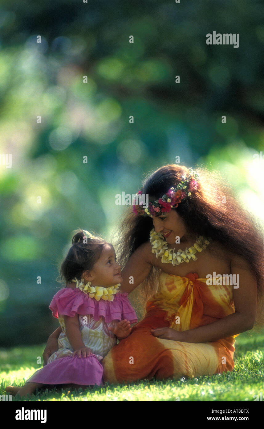 Beautiful Polynesian woman with daughter, dressed in colorful Hawaiian ...