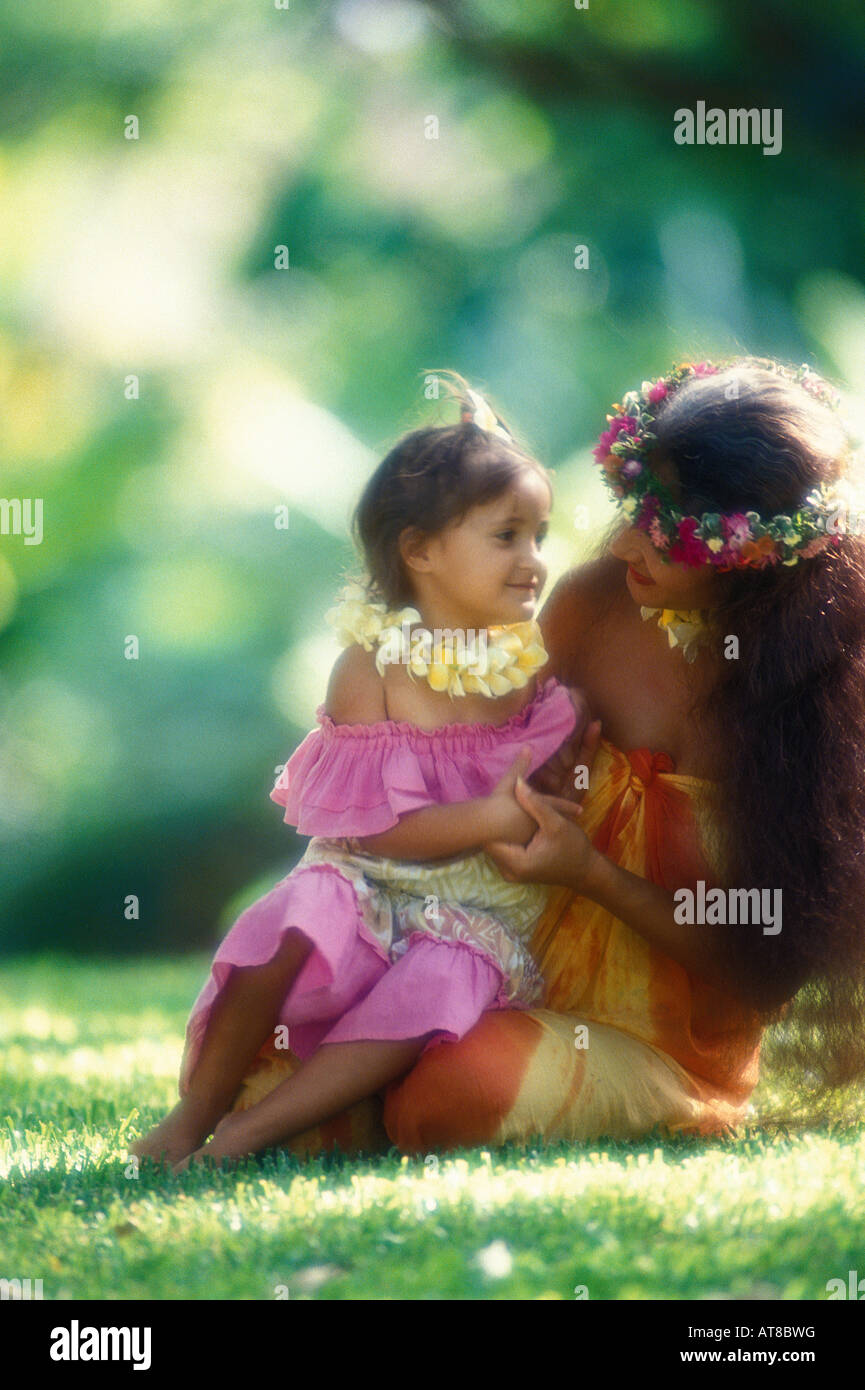 beautiful Polynesian woman with her small daughter both dressed in ...