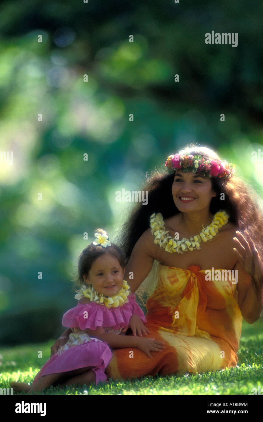 beautiful Polynesian woman with her daughter, both dressed in colorful ...