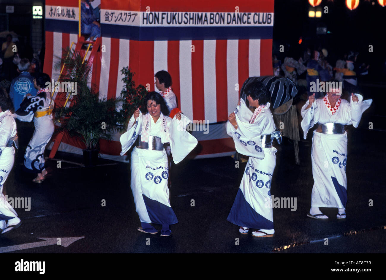 Bon dancers wearing traditional costumes mindfully move with drum beat ...