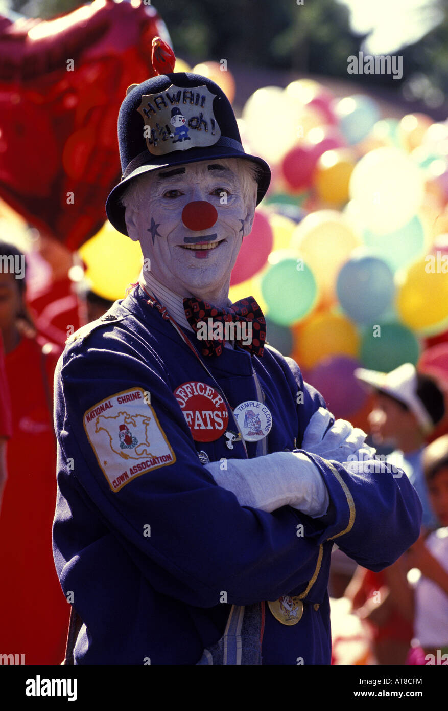 Officer Fats, Shriner clown stands with arms folded background of ...