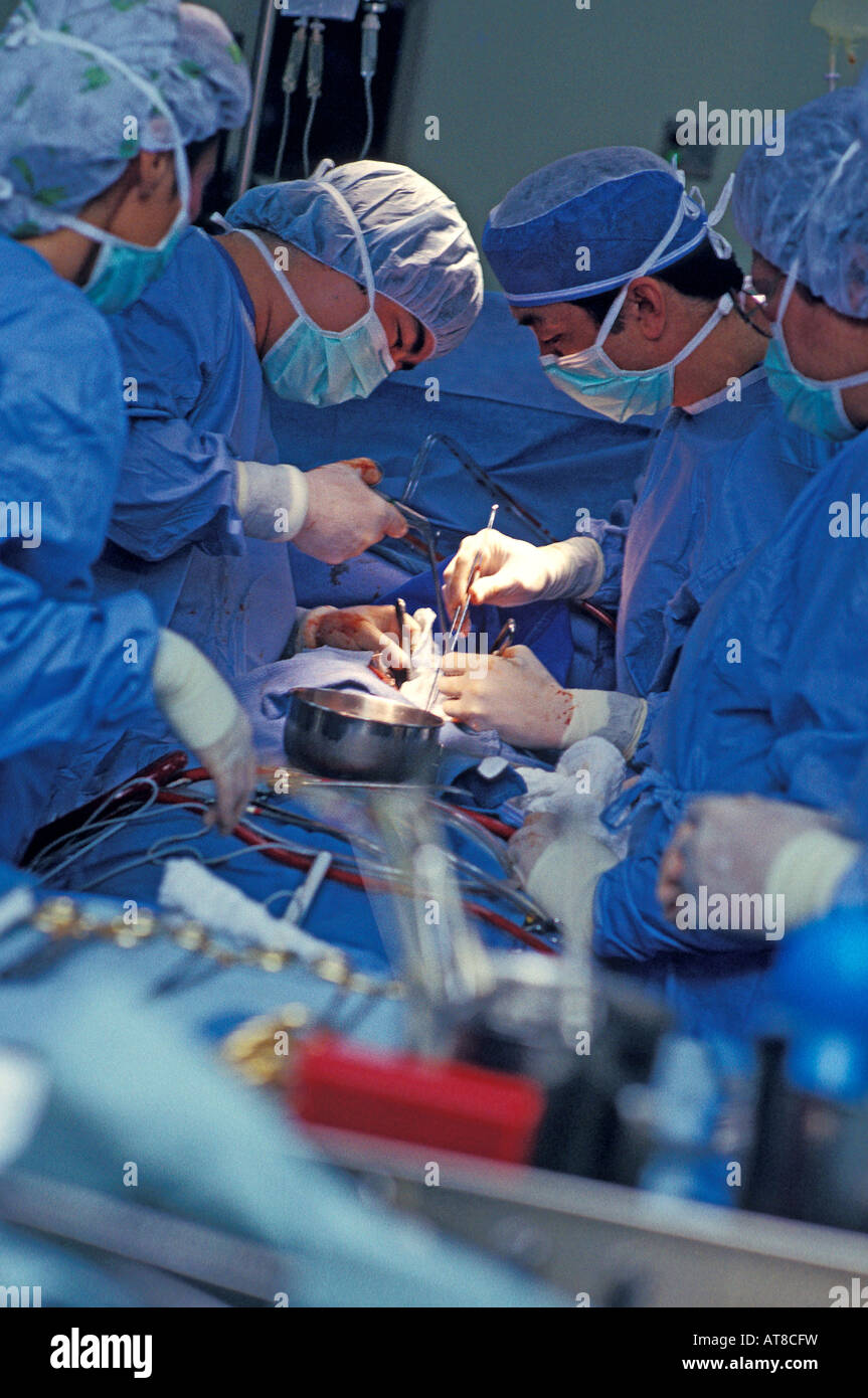 A team of surgeons and nurses perform an open heart surgery Stock Photo ...