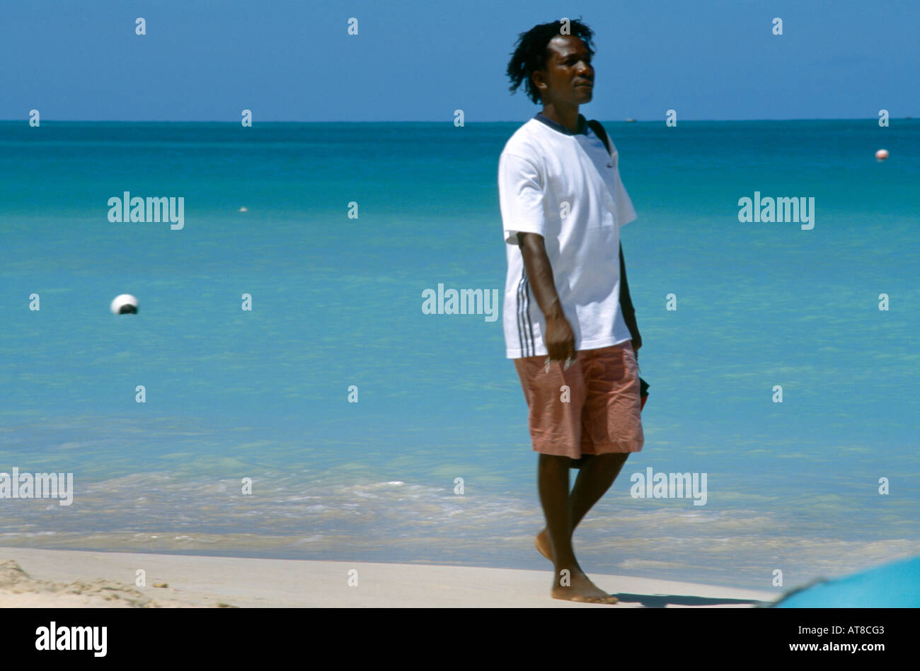 Dickenson Bay Antigua Local Hawker Man on Beach Stock Photo - Alamy