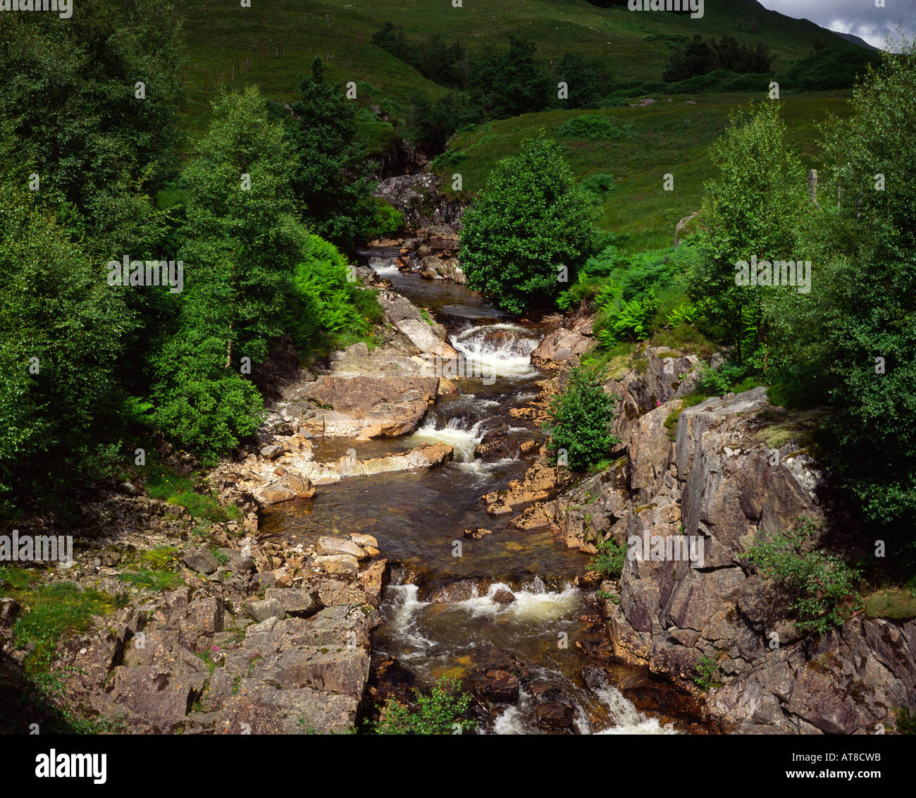 Scottish mountain river flowing between bedrock in Glen Shiel, north ...