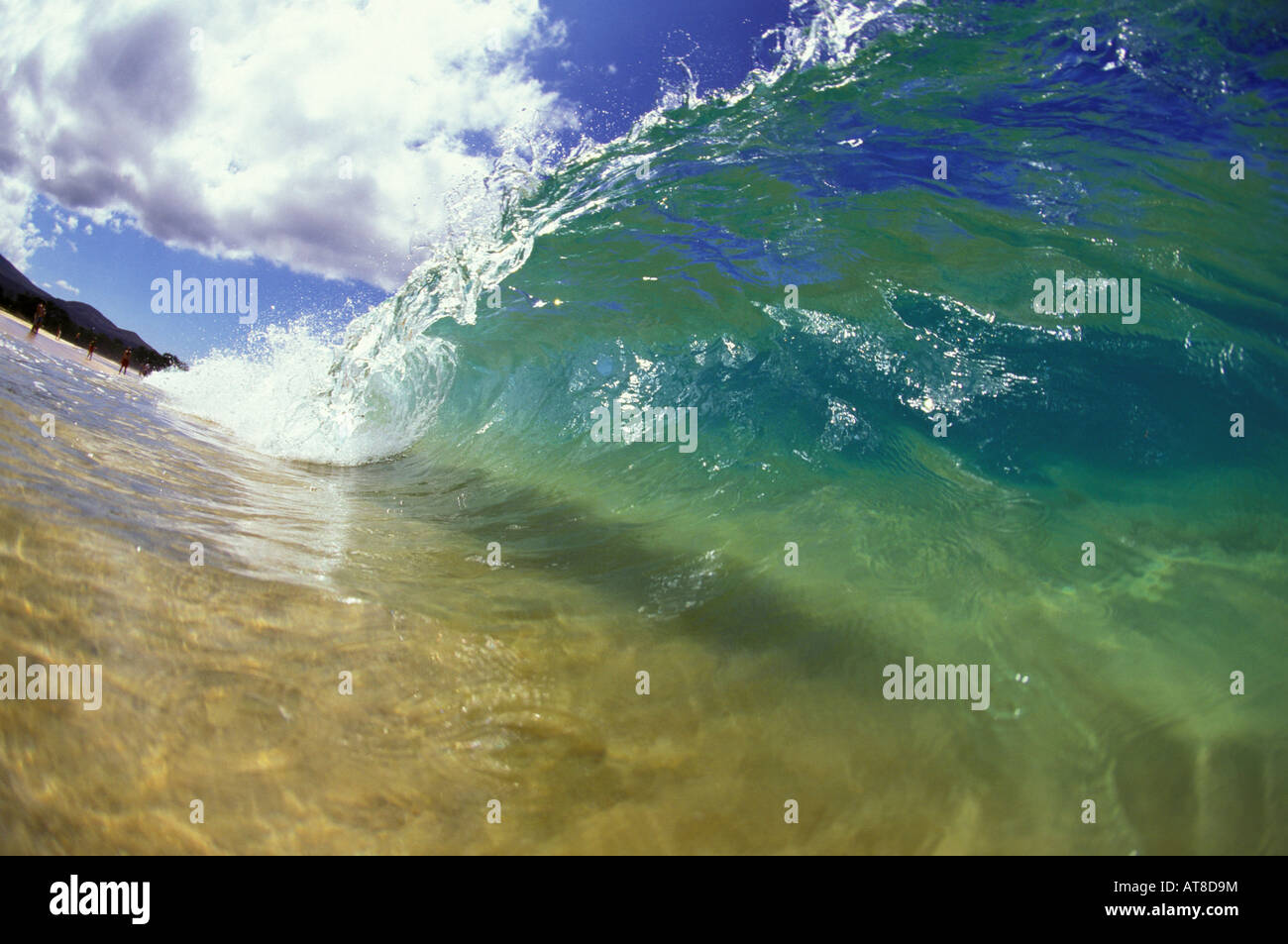Small blue wave crashing on shoreline of Makena beach, Maui Stock Photo ...
