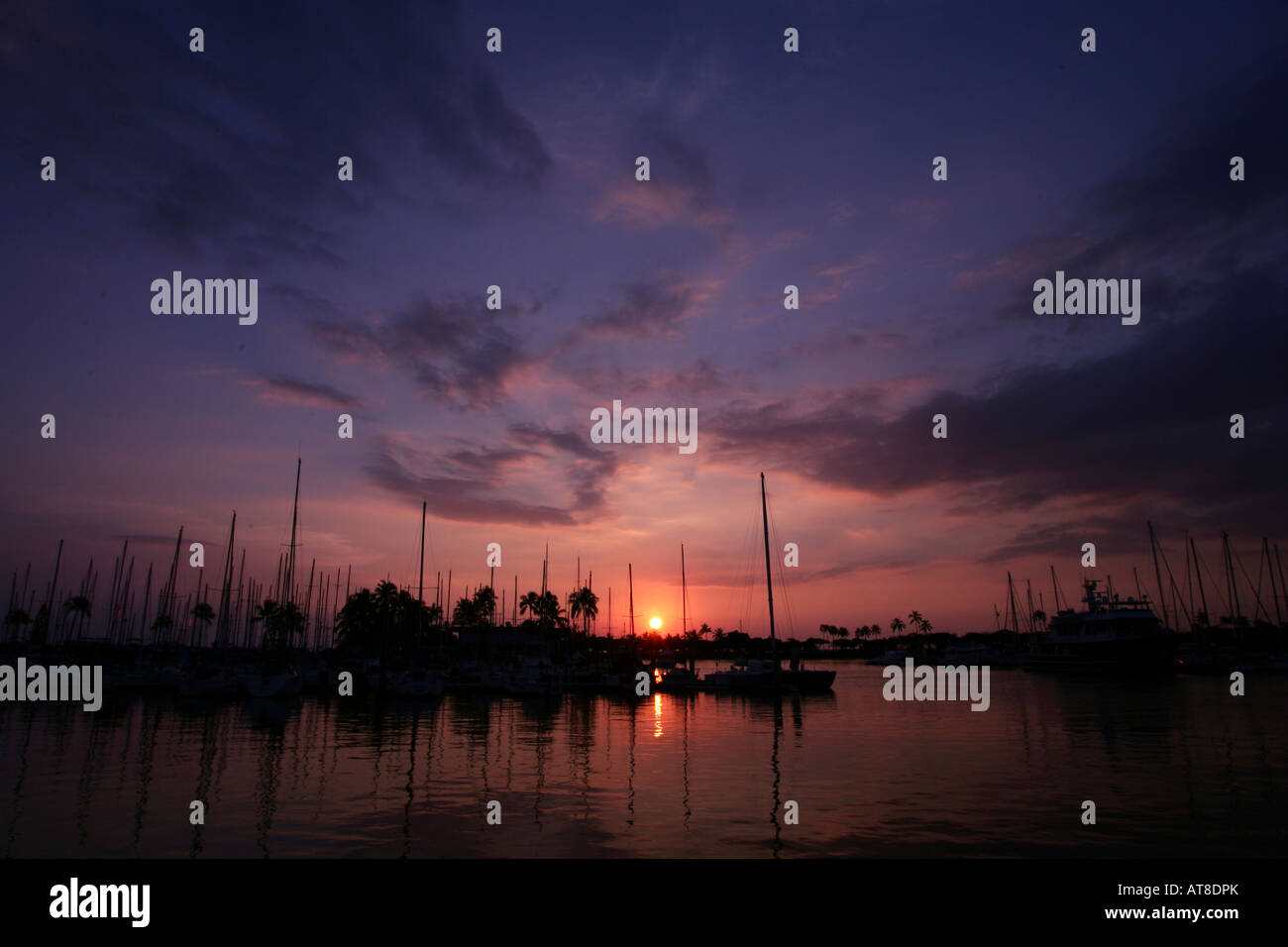 A beautiful hawaiian sunset shows its true colors at the Ala Wai Yatch ...