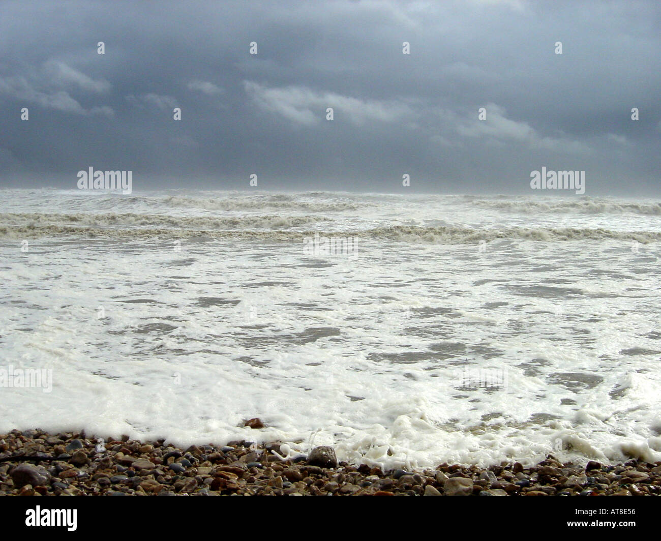 Storm sea waves breaking on beach Stock Photo - Alamy