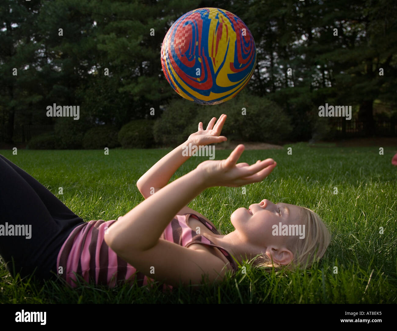 Child tossing ball air hi-res stock photography and images - Alamy