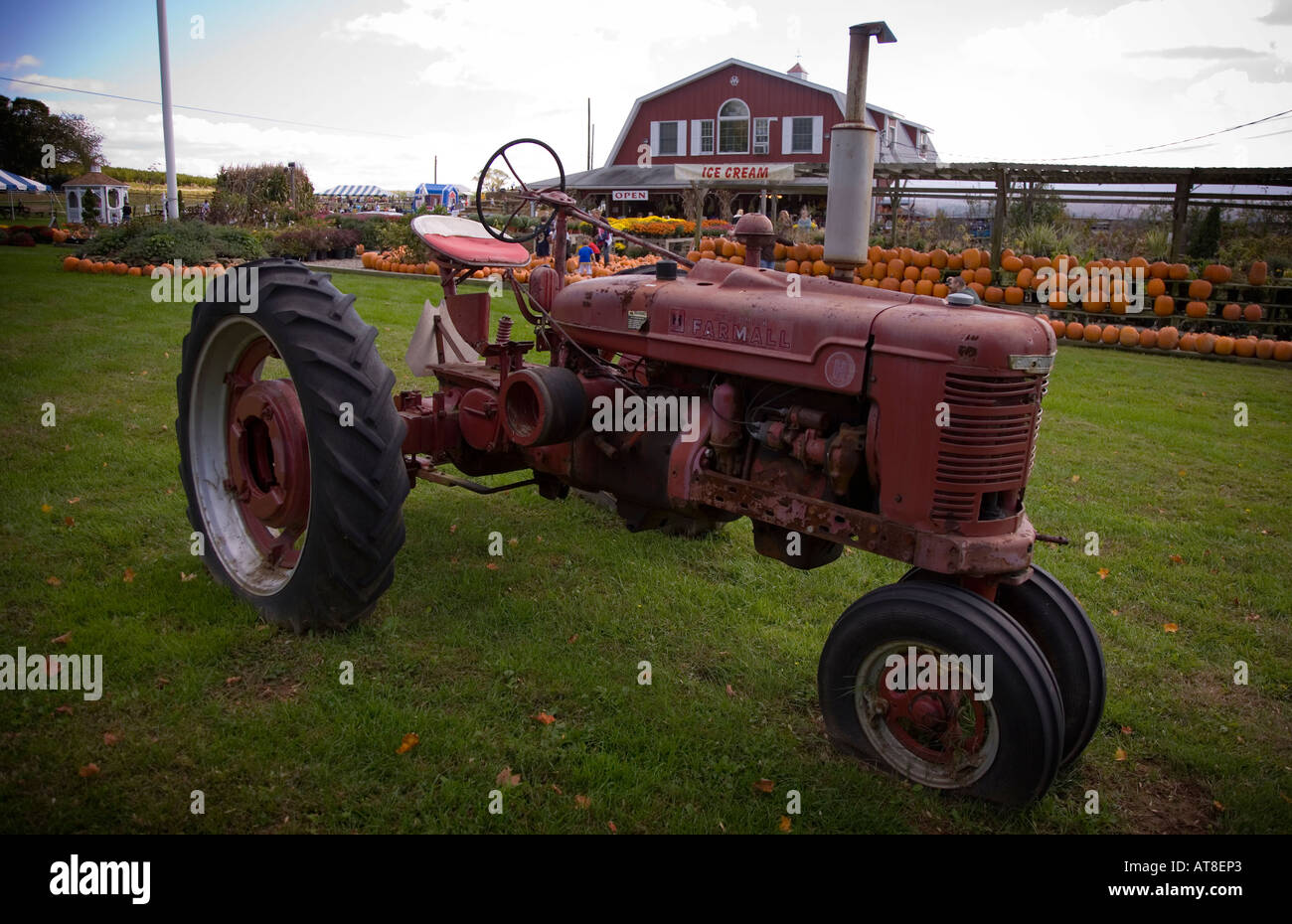 Old farm tractor at a farmstand Stock Photo - Alamy