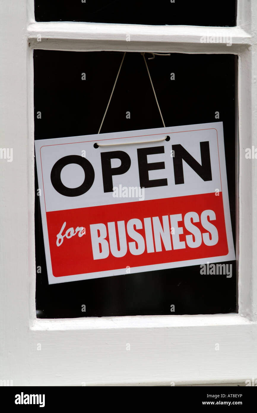 Hanging Sign in shop window Open For Business Stock Photo - Alamy