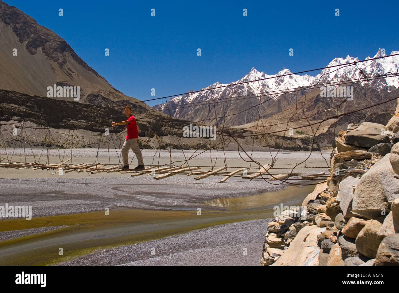 A scary suspension bridge hanging over Hunza river in Passu Pakistan ...