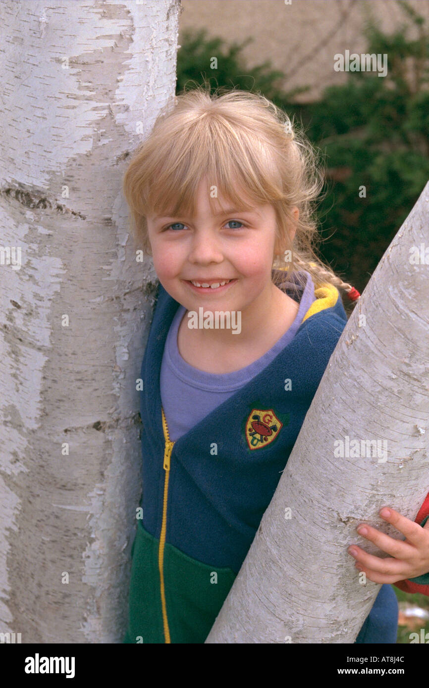 Children playing around tree hi-res stock photography and images - Alamy