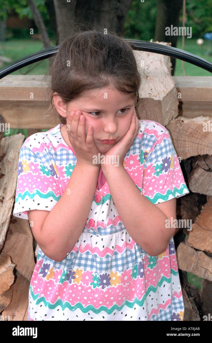 Girl age 6 with hands on face. Downers Grove Illinois USA Stock Photo ...