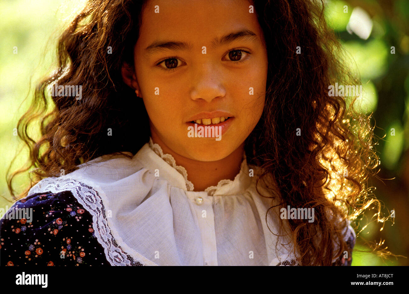 Close-up of a beautiful nine year old Chinese American girl wearing an ...
