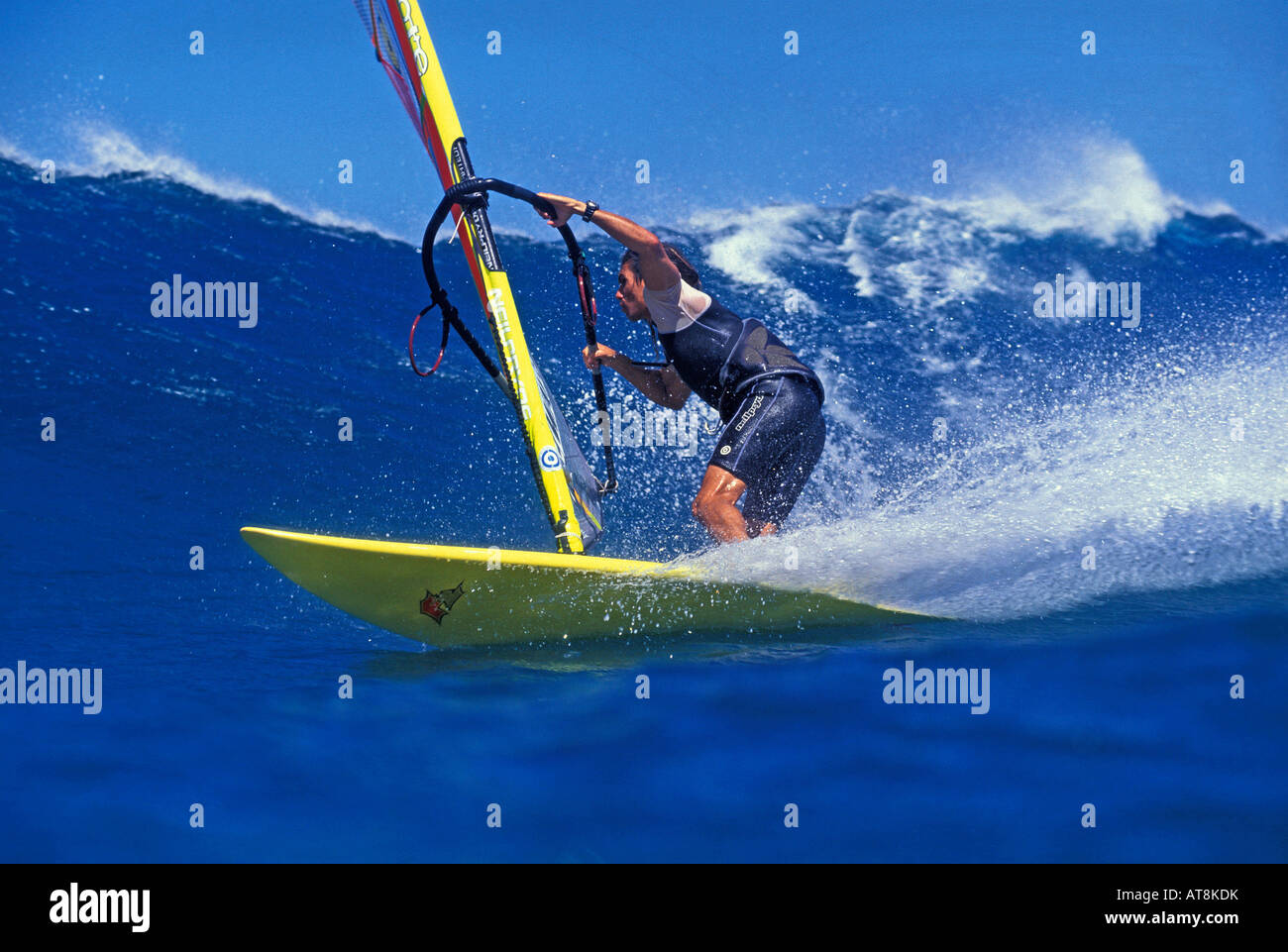 Windsurfing a large blue wave at world famous Hookipa Beach Park on ...