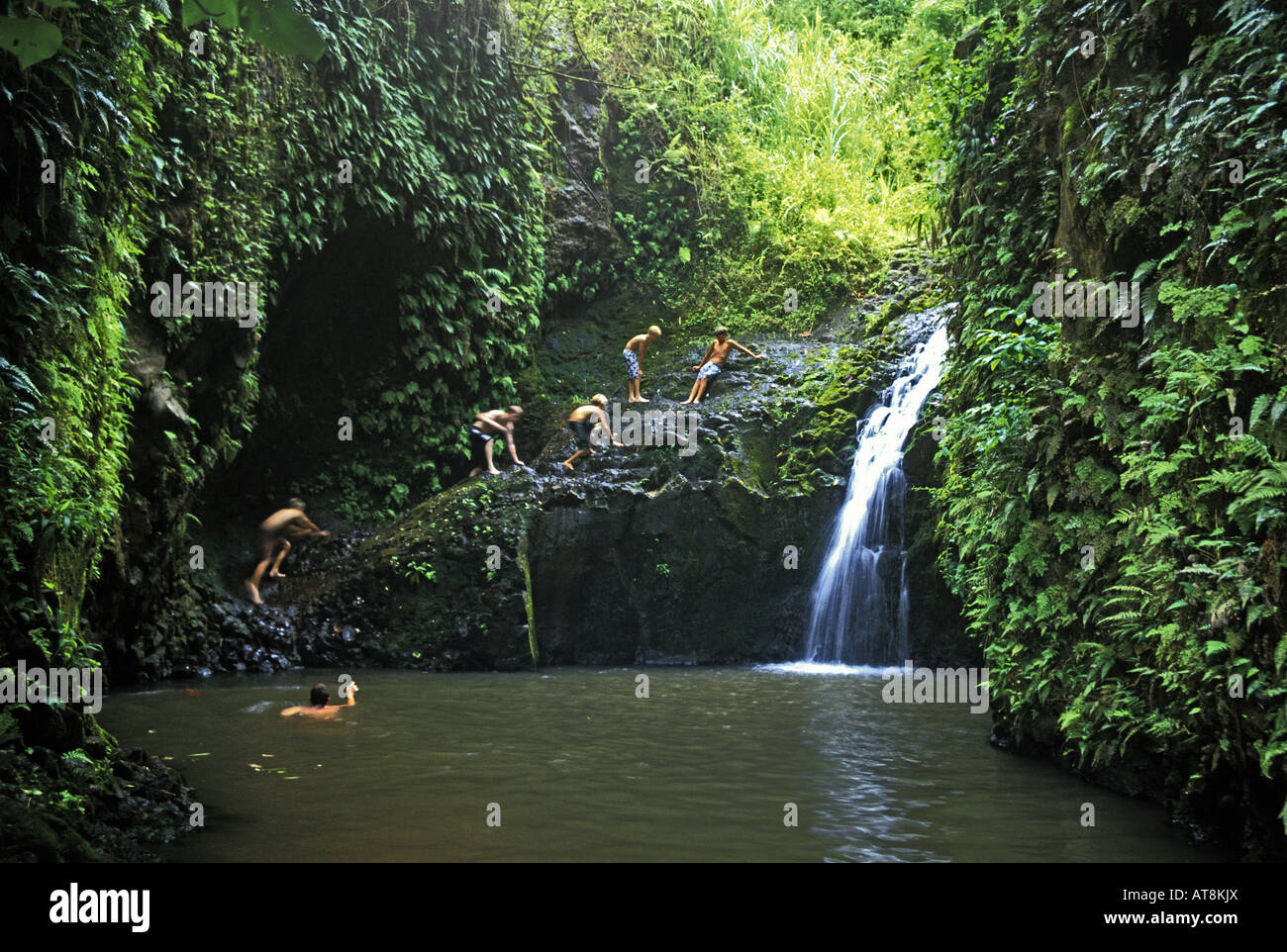 EDITORIAL ONLY. Hikers enjoy a cool dip in the waterfalls and pool at ...