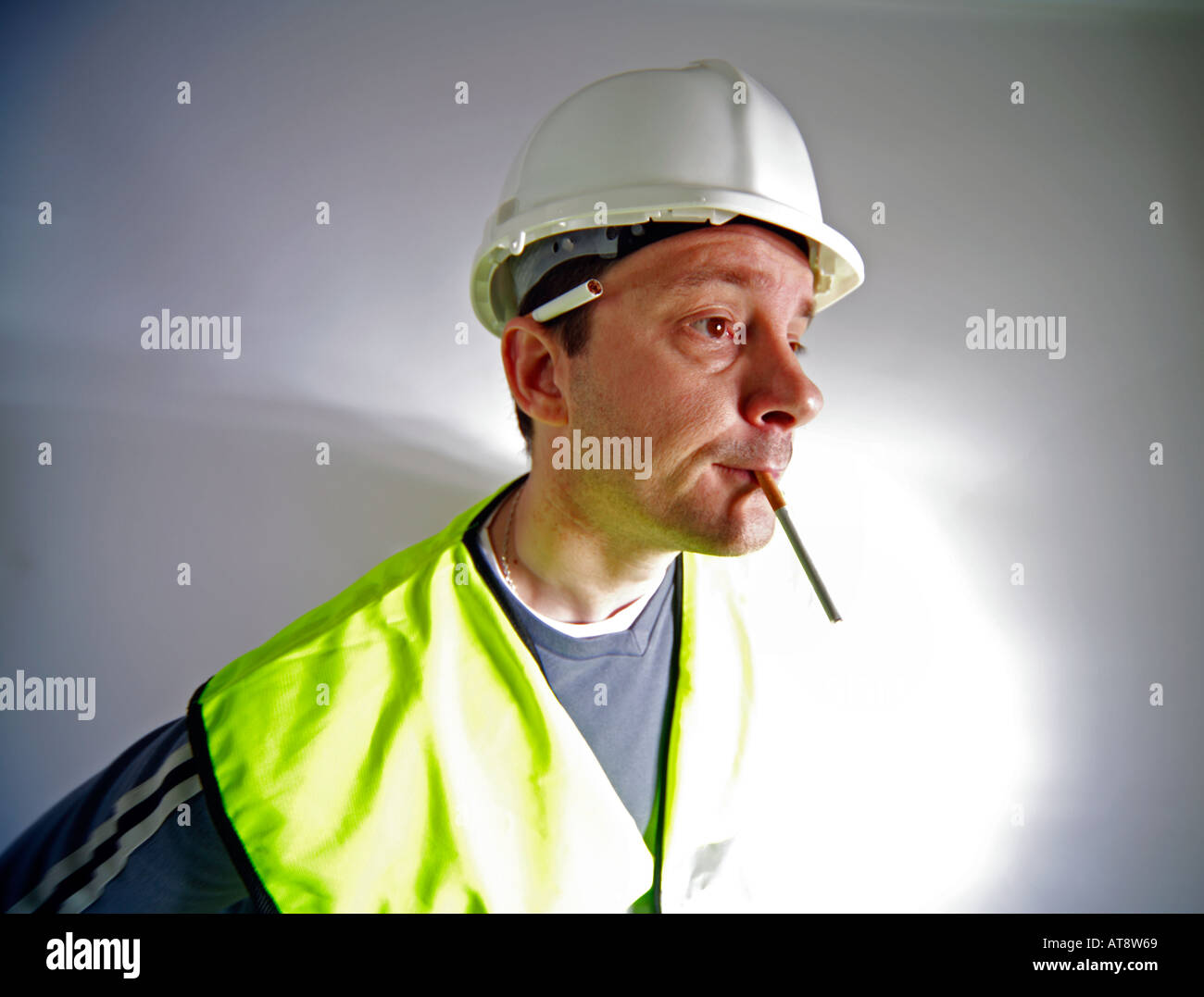 Dopy looking construction worker with cigarette in his mouth Stock ...