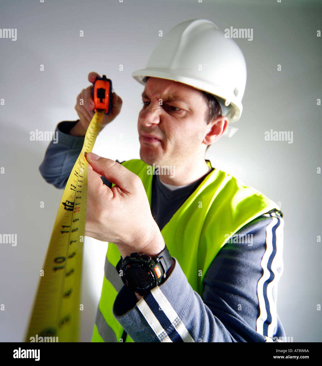 Construction Worker Measuring