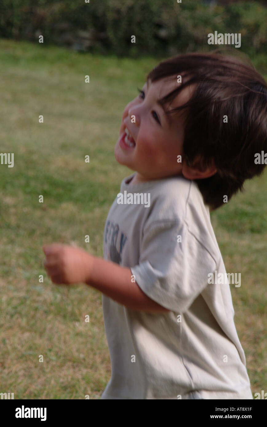 Little boy running, laughing Stock Photo - Alamy