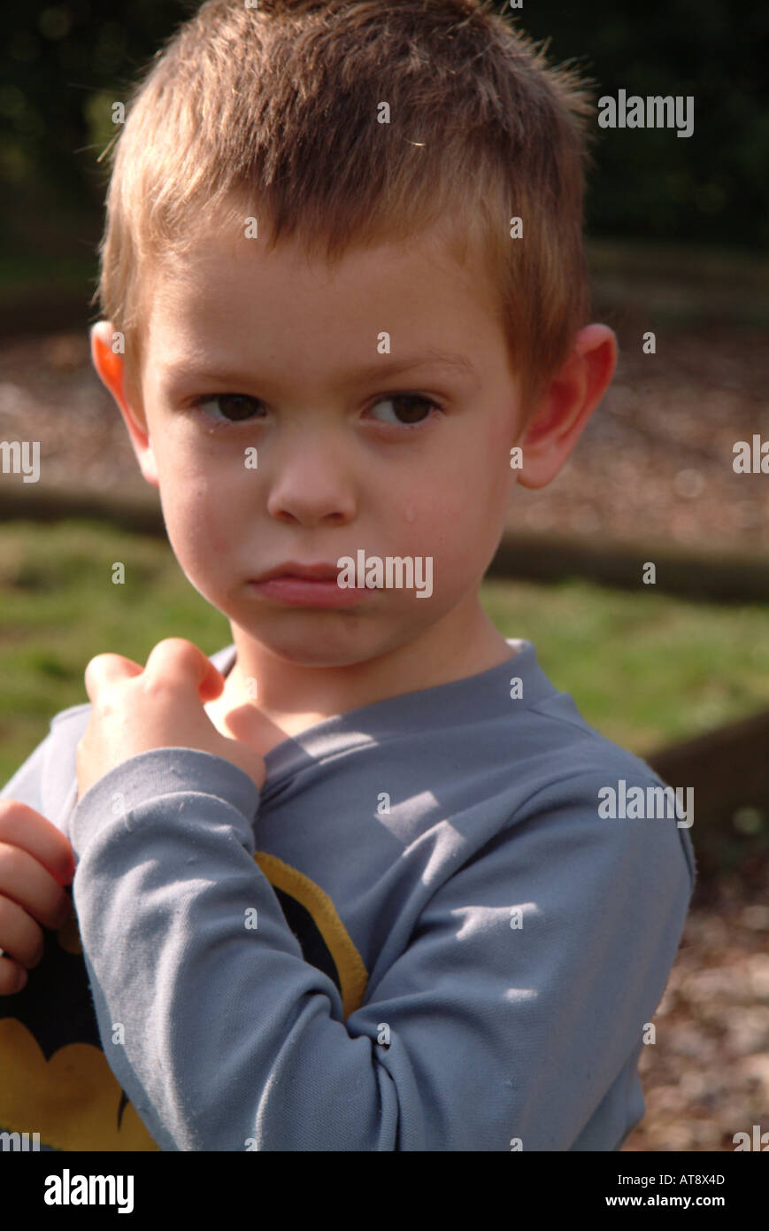 Little boy looking unhappy Stock Photo - Alamy