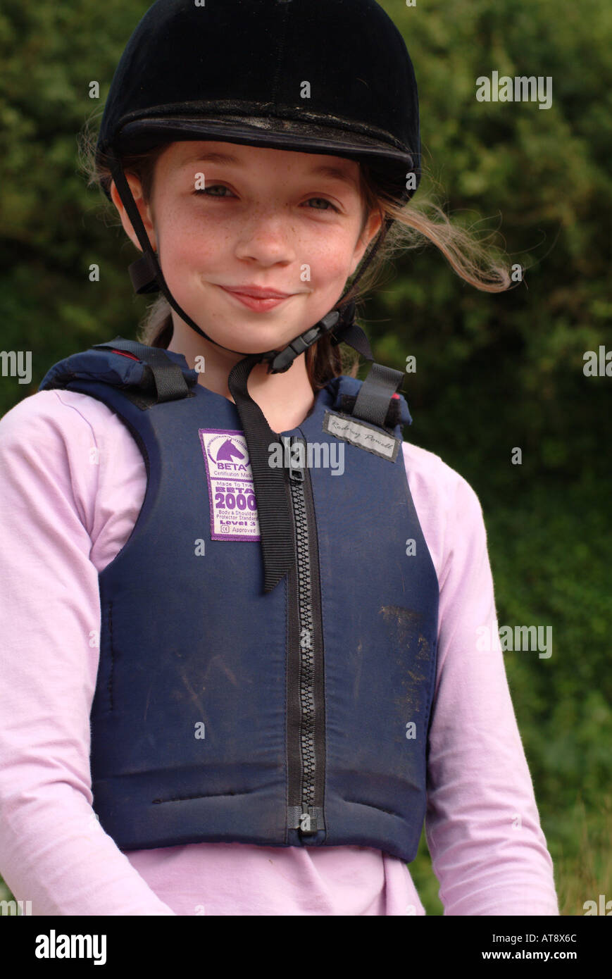 Portrait of a young girl wearing a riding hat Stock Photo - Alamy