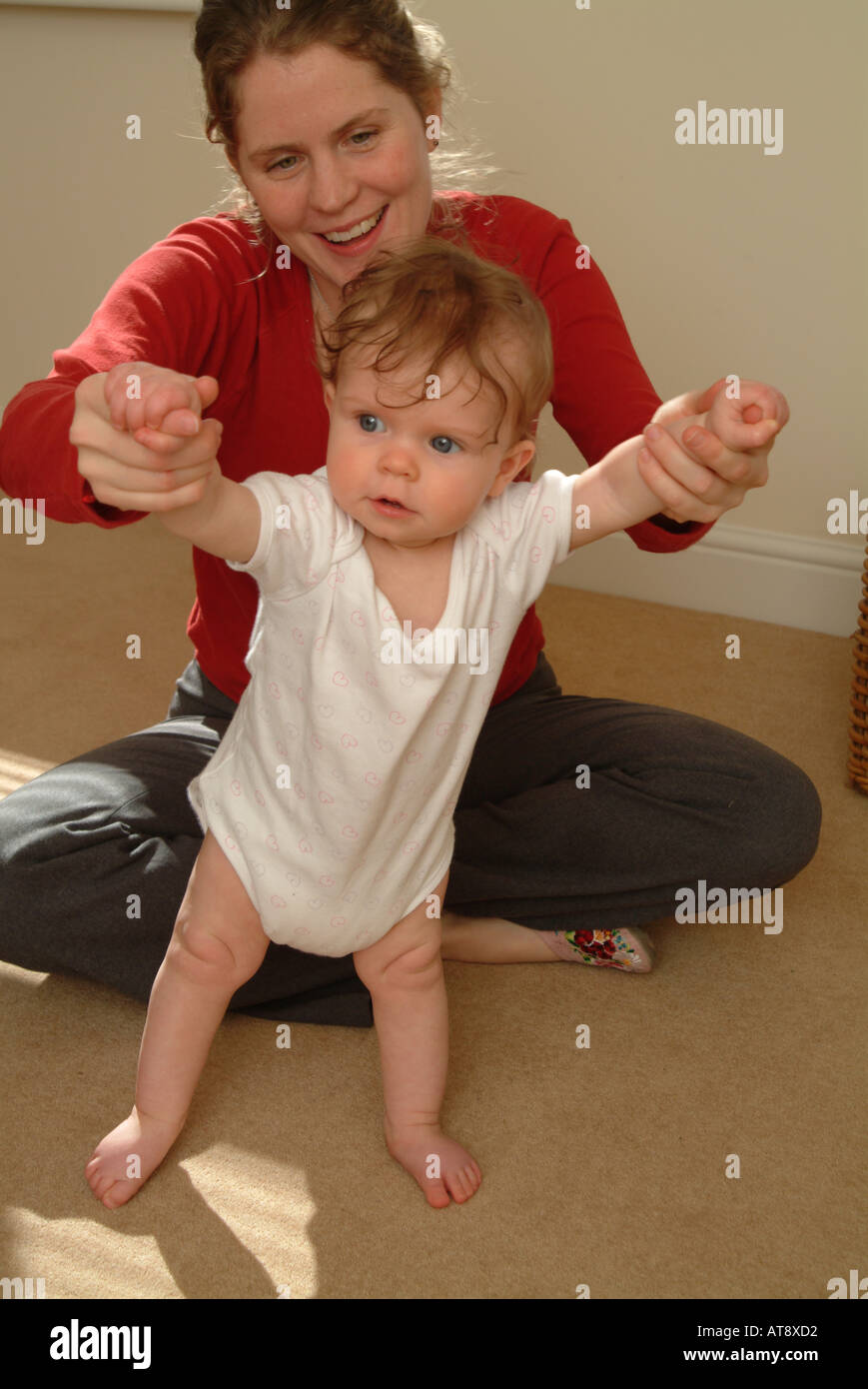 Toddler taking her first steps Stock Photo - Alamy
