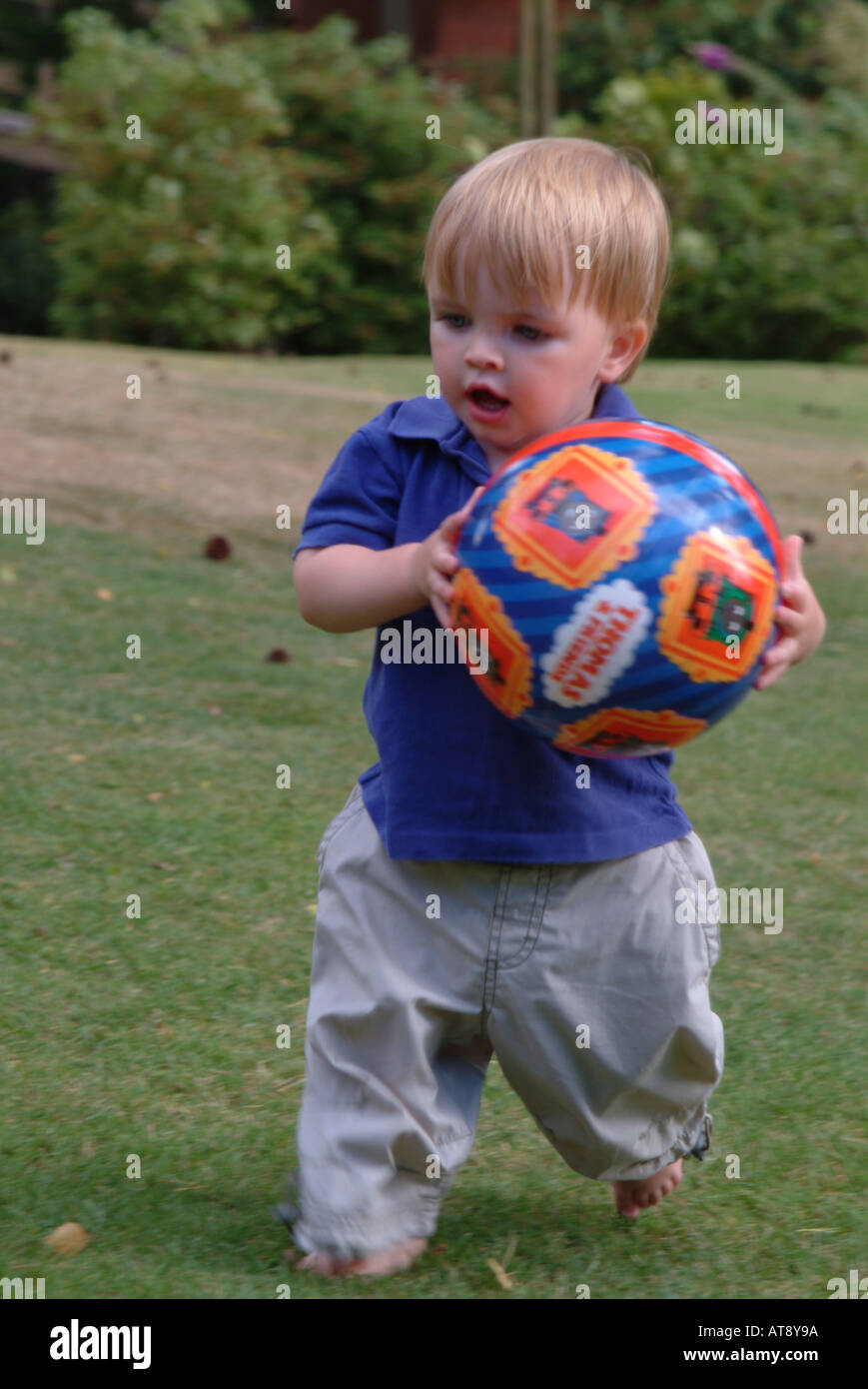Blonde child running park hi-res stock photography and images - Alamy