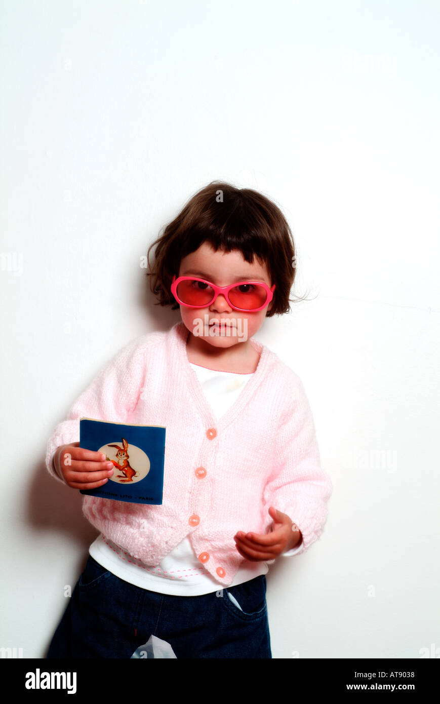 child holding a book Stock Photo - Alamy