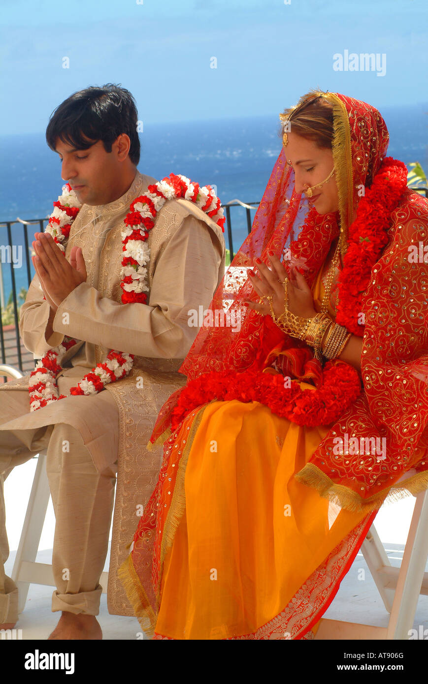 Tradditional Hindi wedding with groom wearing carnation flowers and ...