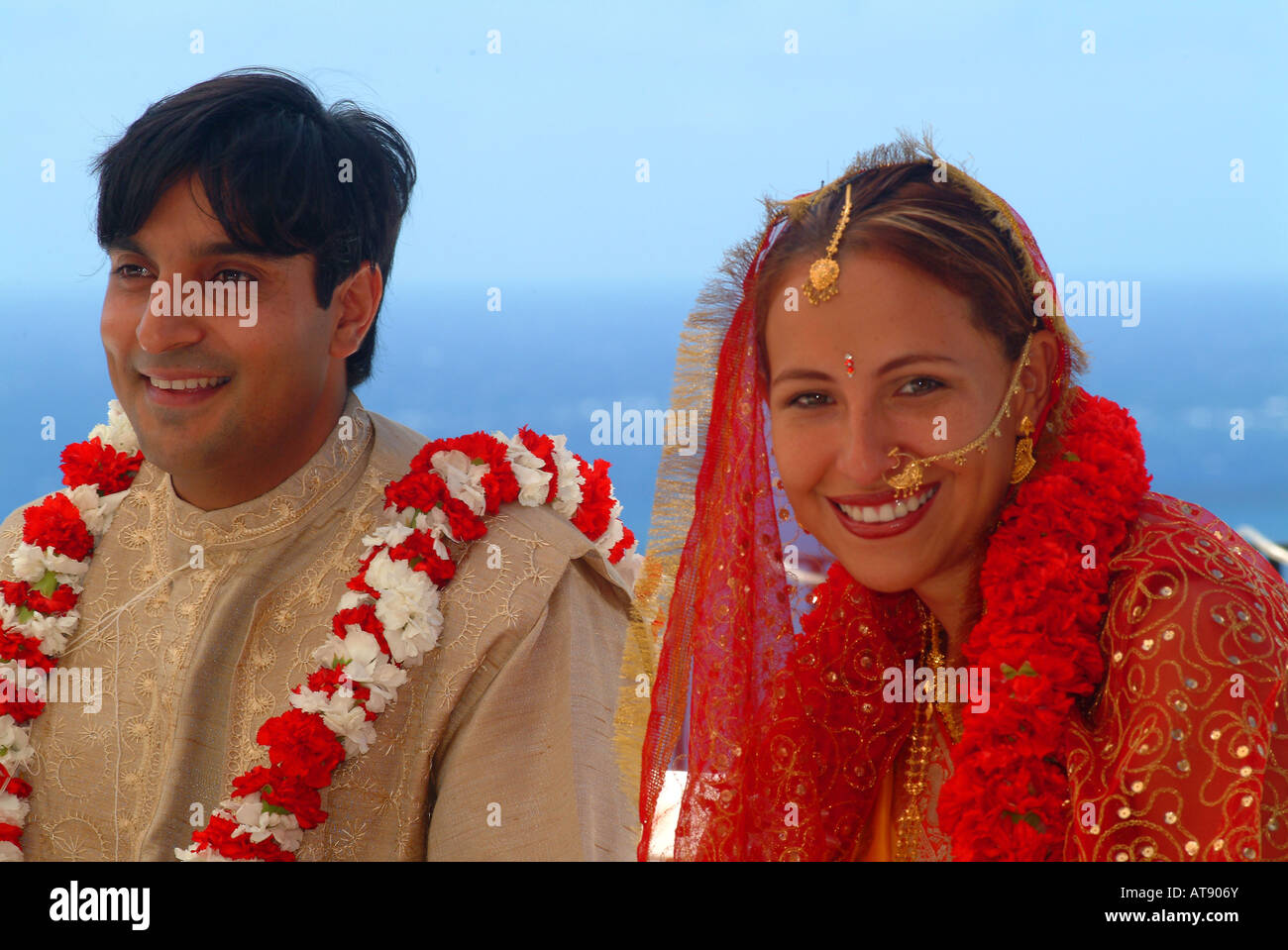 Tradditional Hindi wedding with groom wearing carnation flowers and ...