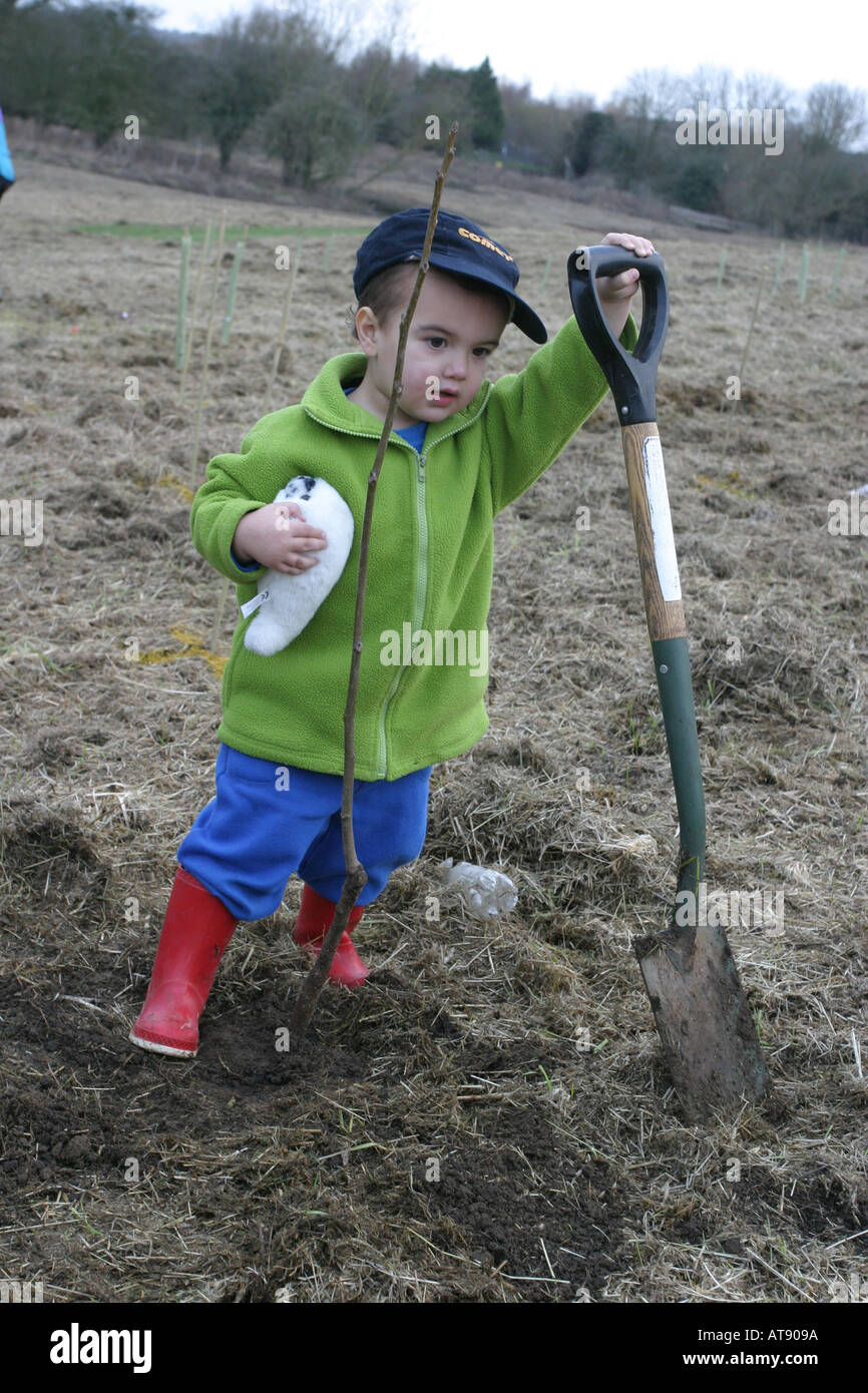 Boy planting a tree uk hi-res stock photography and images - Alamy