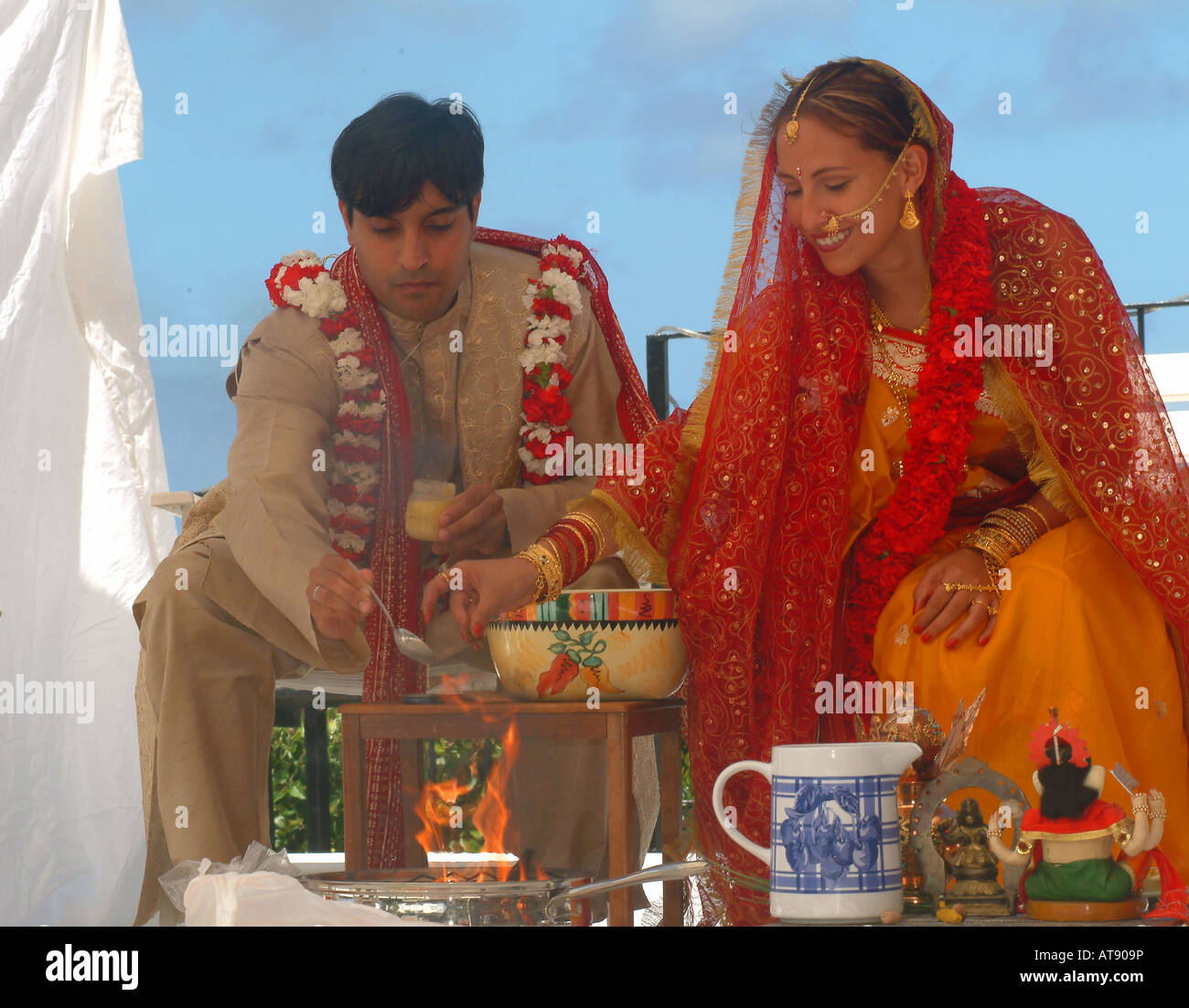 Tradditional Hindi wedding with groom wearing carnation flowers and ...